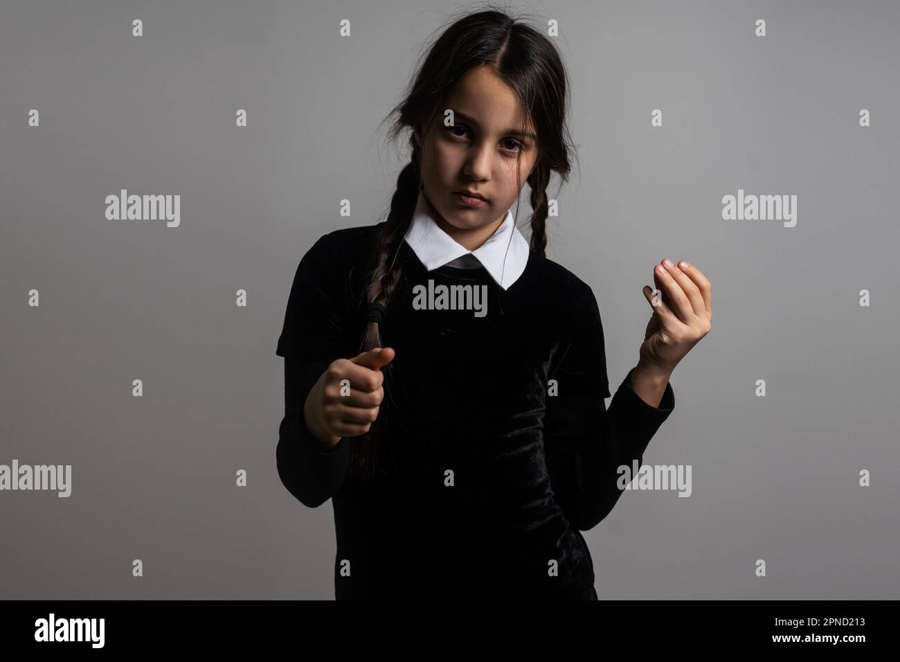 a girl Wednesday Addams. Halloween party Stock Photo - Alamy