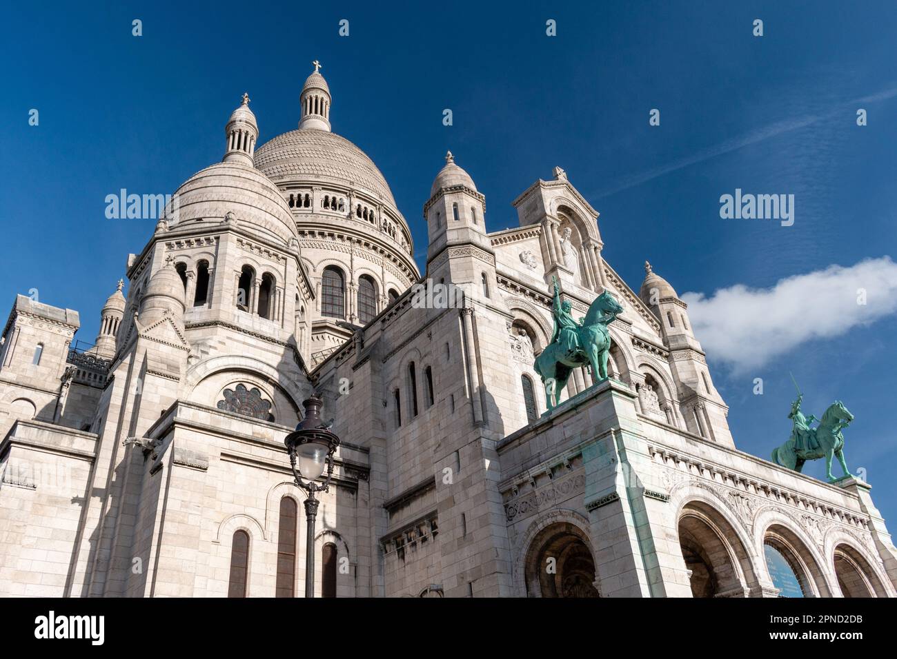Basilica of Sacre Coeur - front view of domes and statues Stock Photo ...