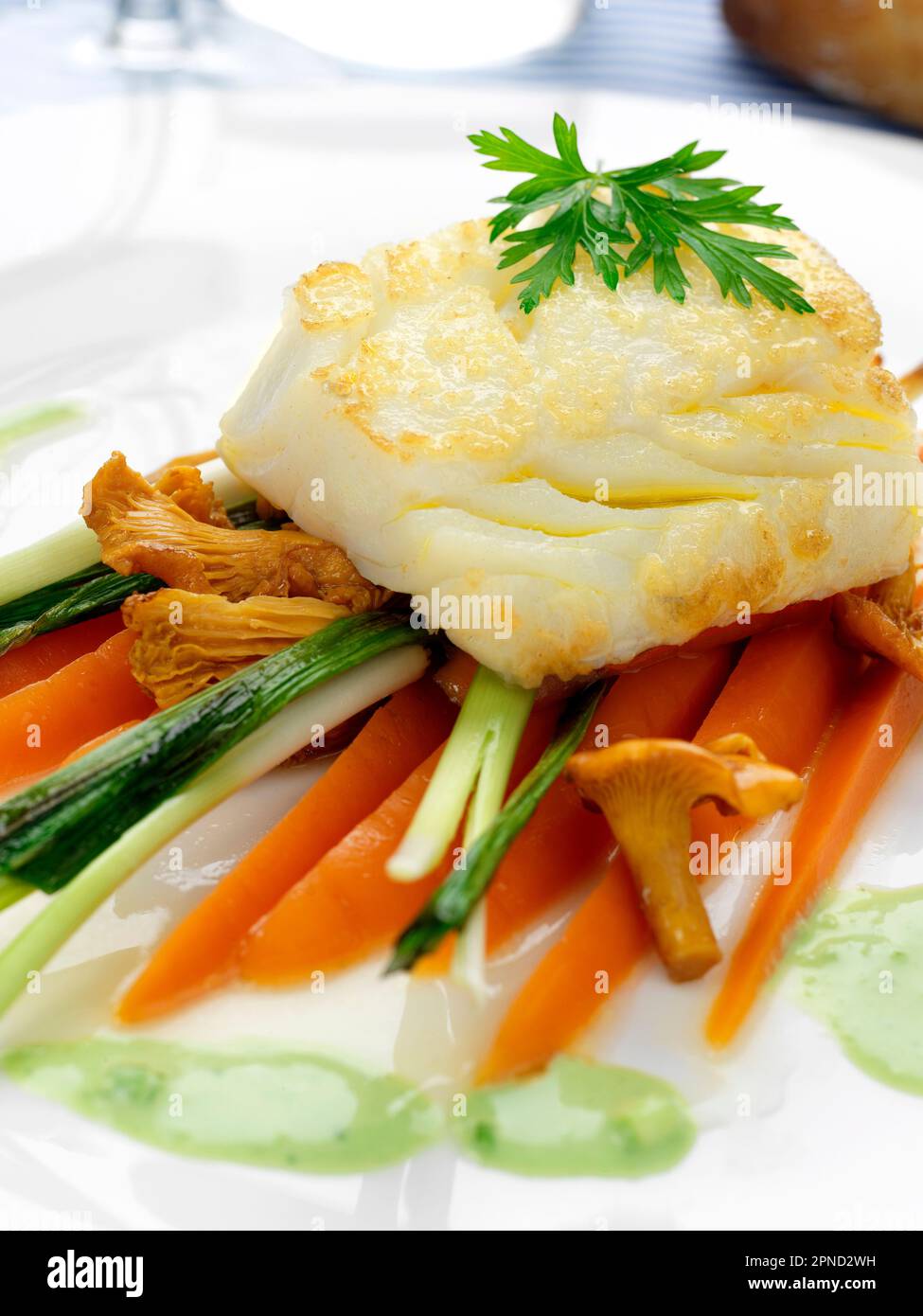 Baked cod on zucchini and carrot stripes with chanterelle mushroom ...