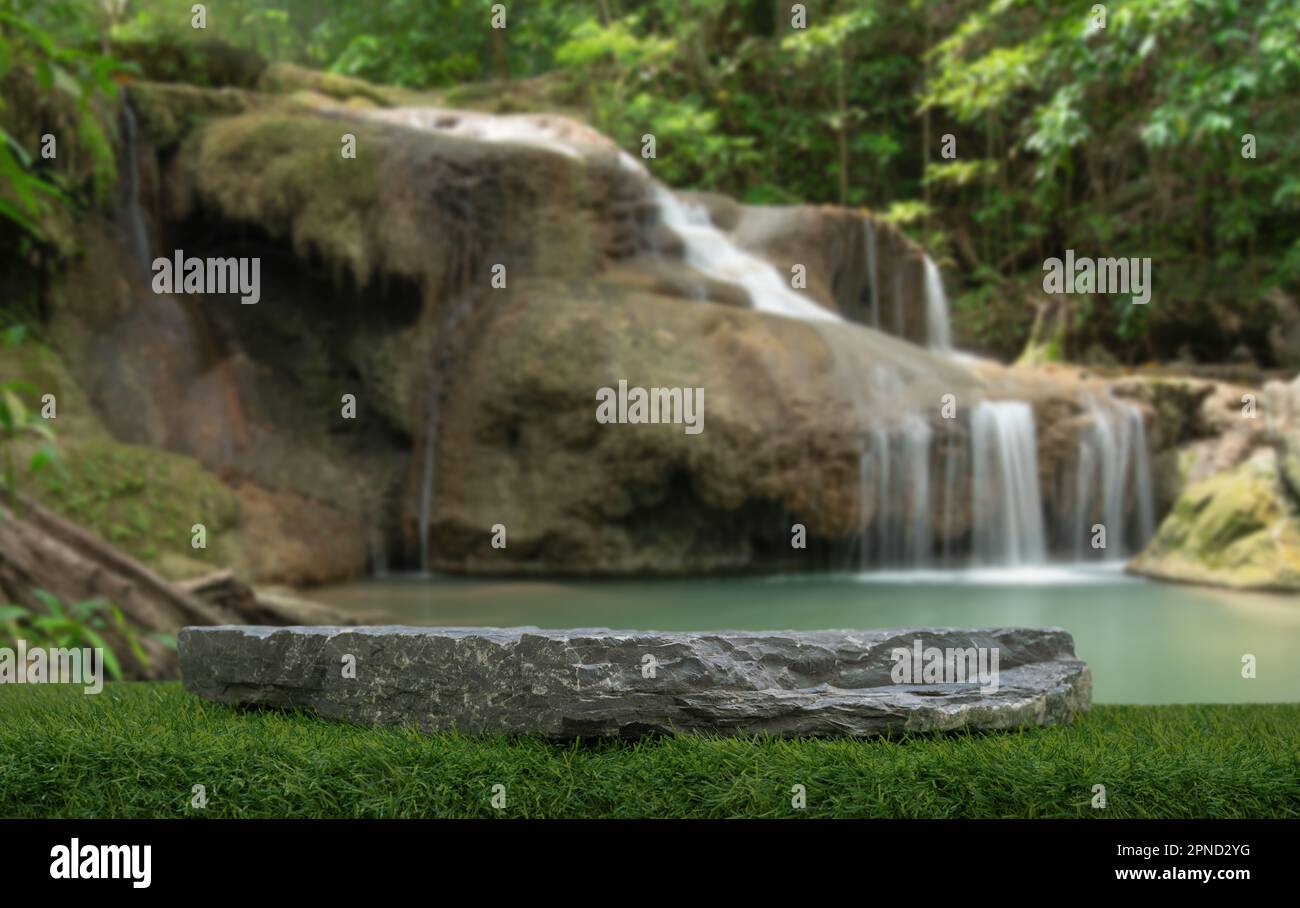 Stone table top podium floor in outdoor waterfall green tropical forest ...