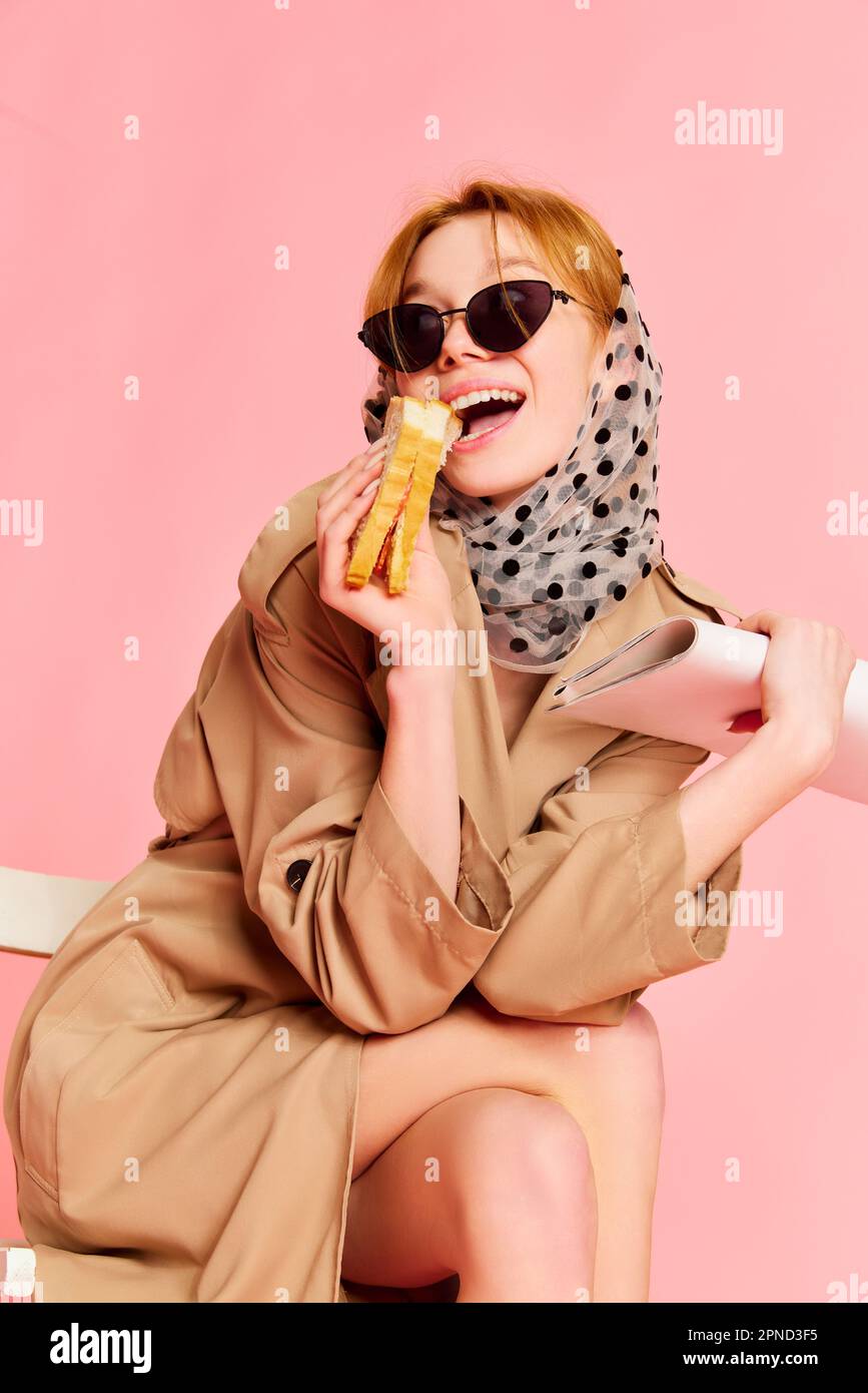 Portrait of girl wearing elegant clothes with head scarf and trench ...