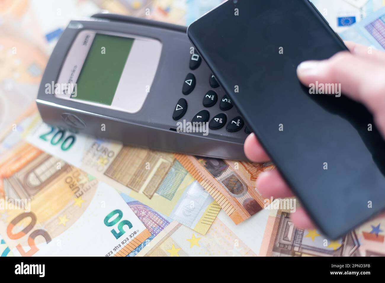 Payment transaction with smartphone or banknotes Euro Stock Photo - Alamy
