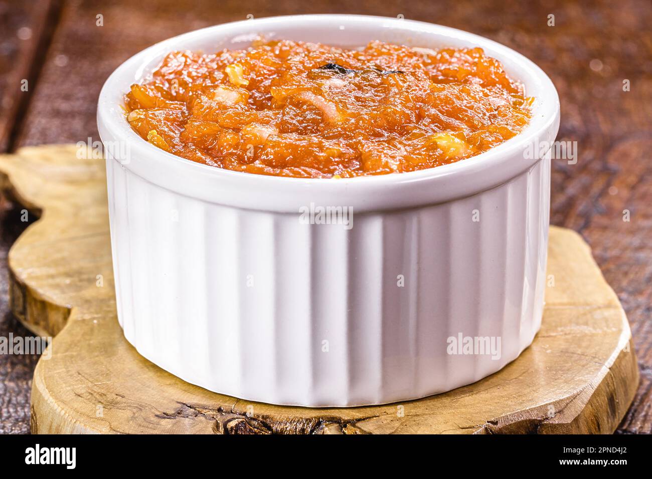 Brazilian pumpkin jam made by emc asa, in a rustic wooden setting ...