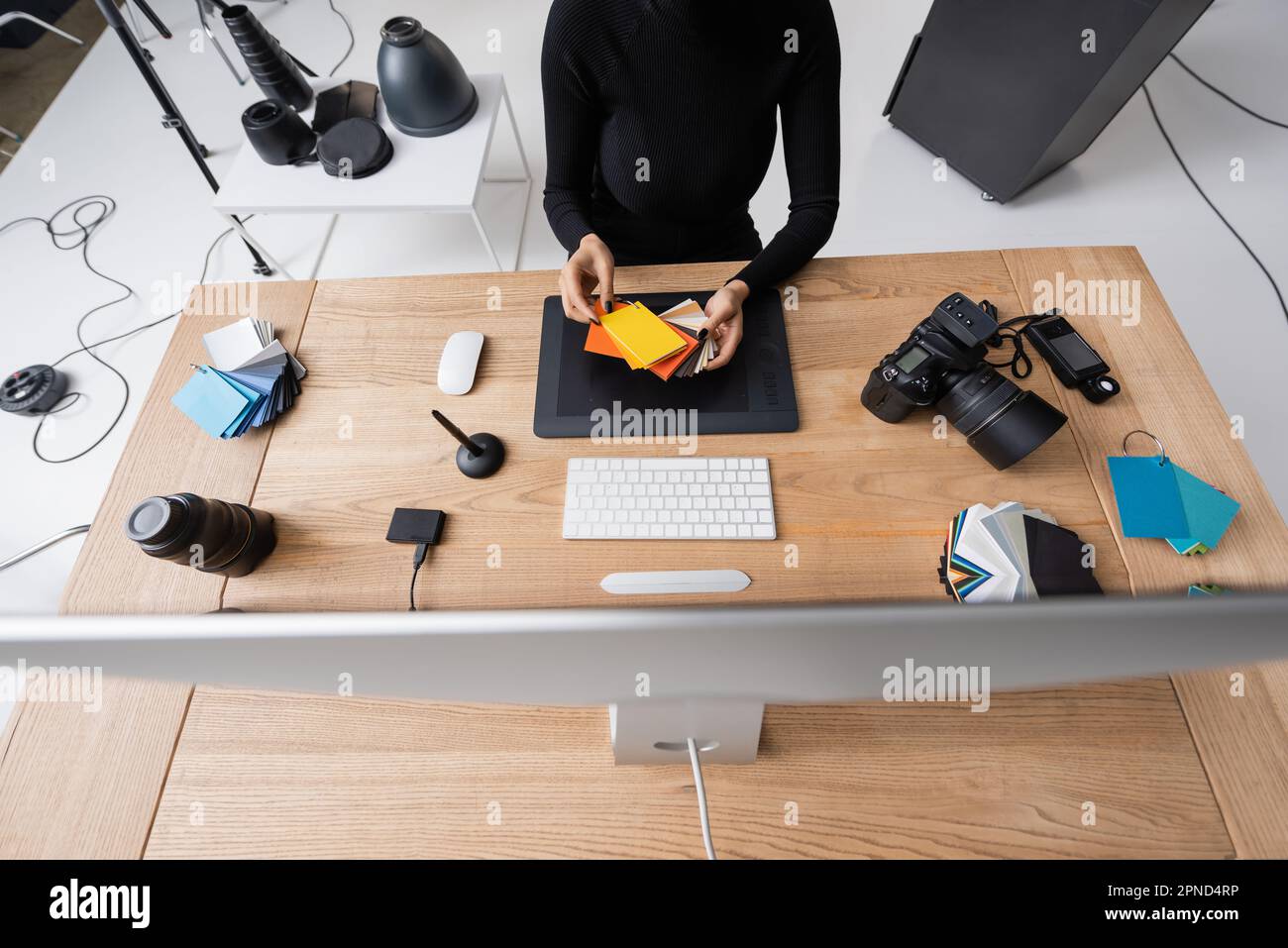 top view of cropped african american retoucher choosing colors near ...