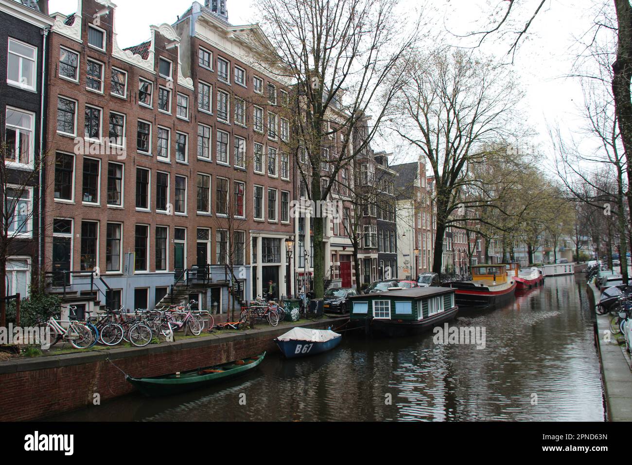 canal, river and old brick houses or flat buildings in amsterdam (the ...