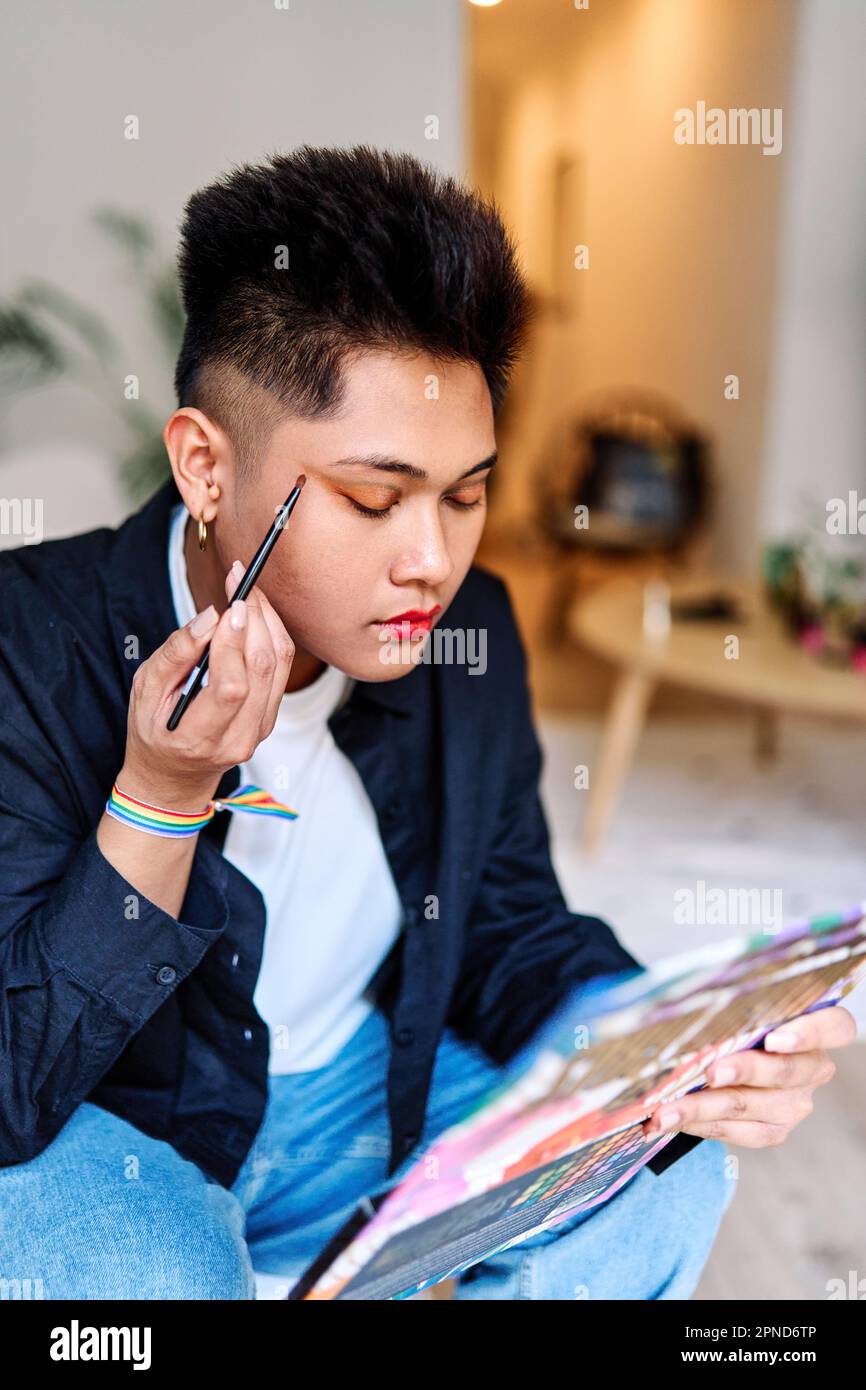 Man applying makeup transgender hi-res stock photography and images - Alamy