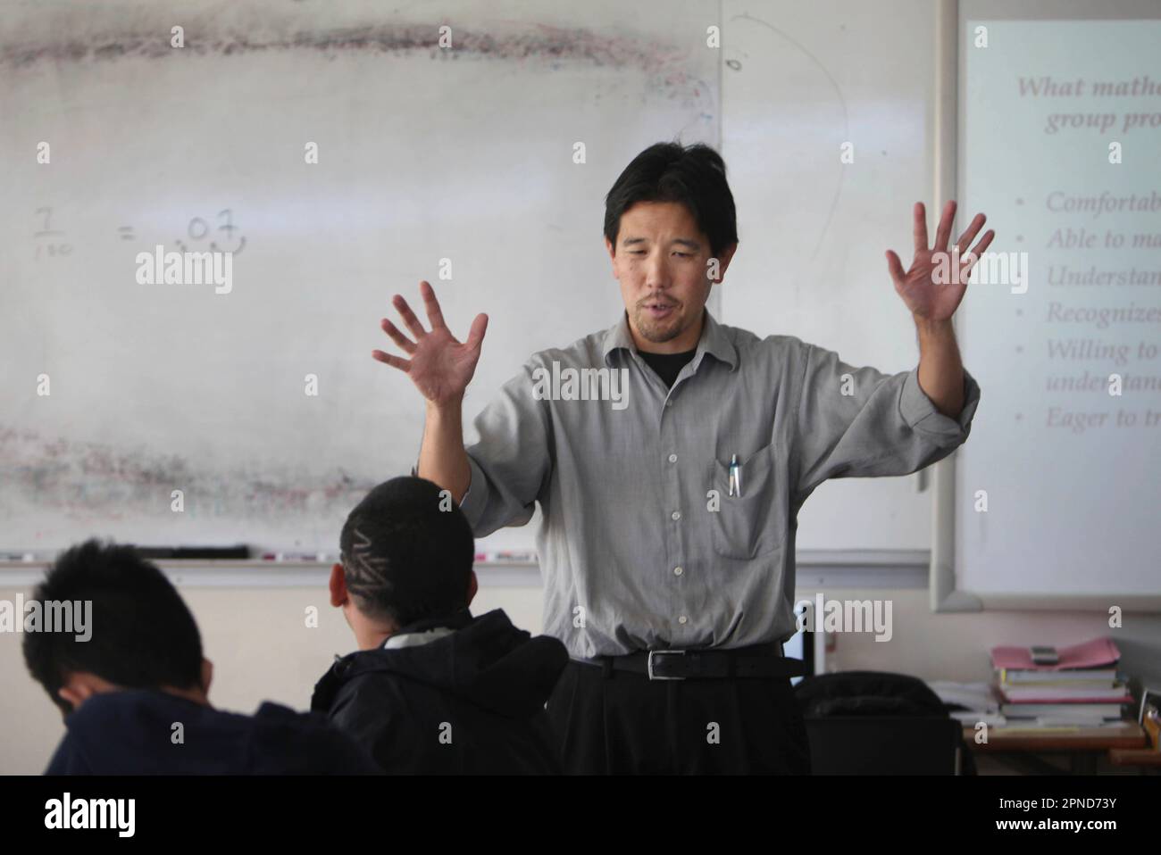 Math instructor Dan Yamamoto gives instruction during an Algebra II ...