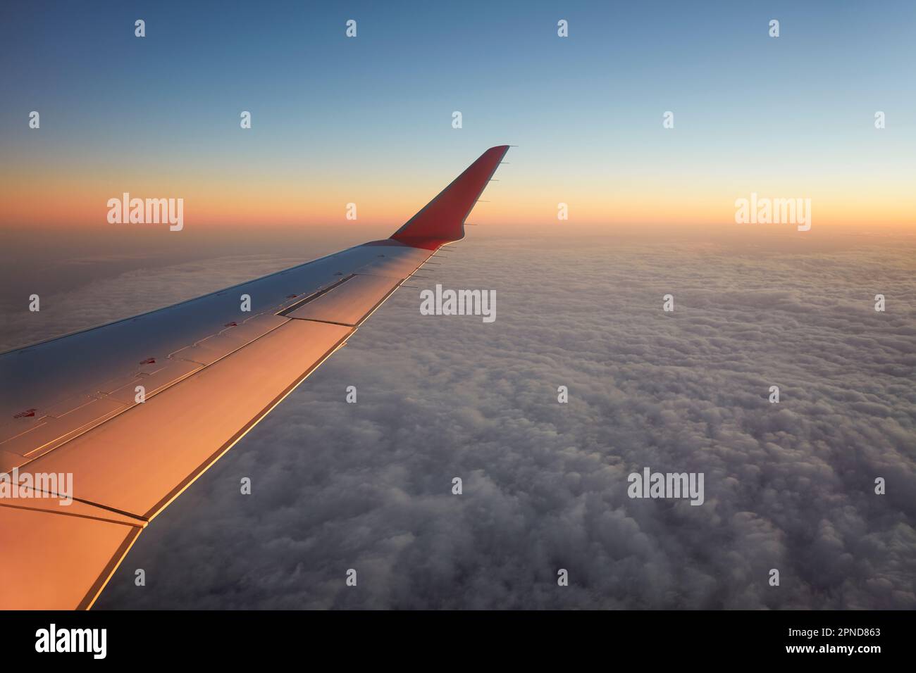 The wing of an Iberia plane flying over Europe at twilight Stock Photo ...