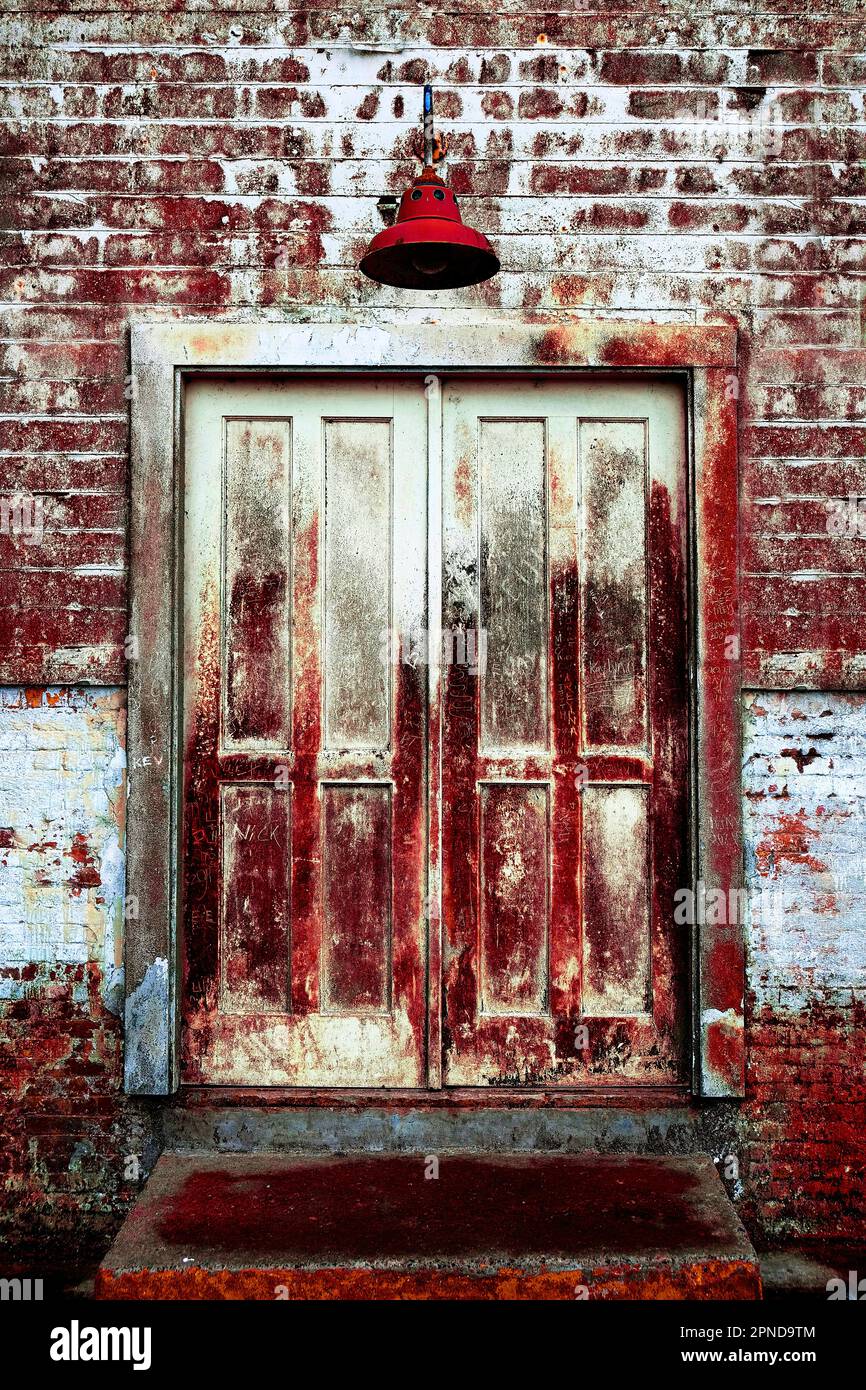 Detail of old door painted white paint peeling chipped red Stock Photo ...