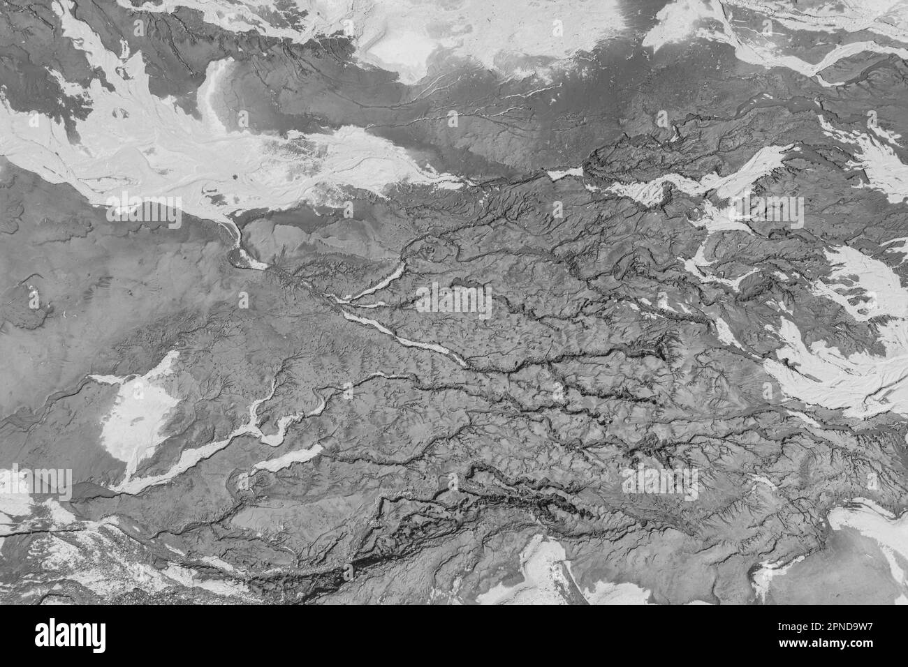 The structure of cracked wet earth at the bottom of the lake, creating ...