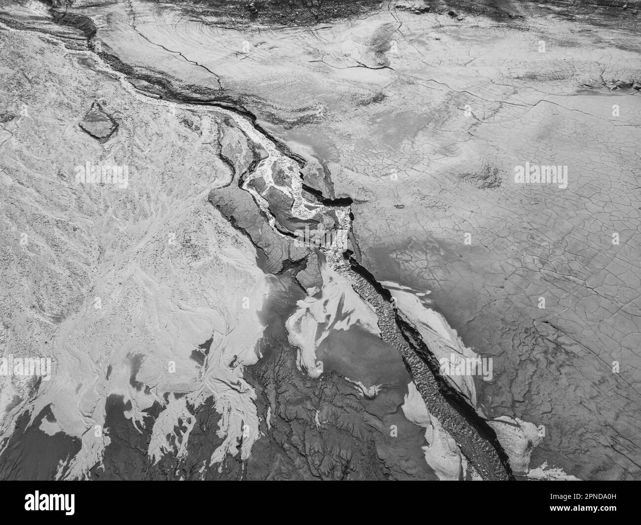 The structure of cracked wet earth at the bottom of the lake, creating ...