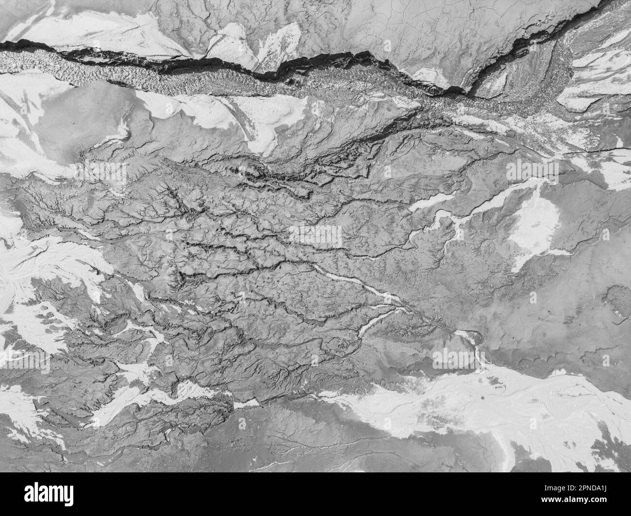 The structure of cracked wet earth at the bottom of the lake, creating ...