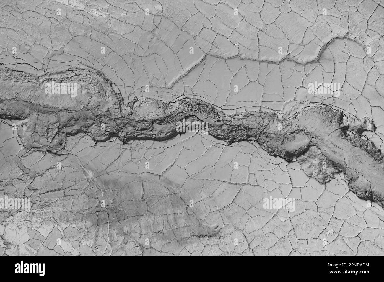 The structure of cracked wet earth at the bottom of the lake, creating ...