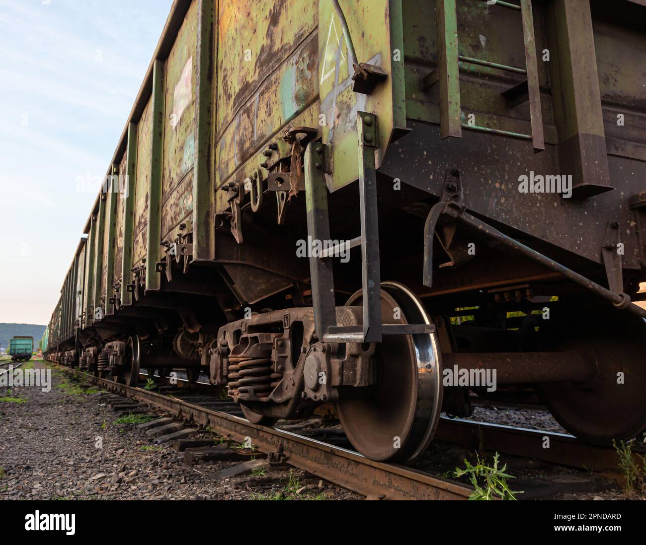 Old rusty railway cars stand on the tracks of the station Stock Photo ...