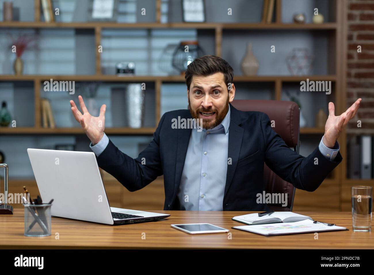 Angry boss yelling at camera, mature senior man working inside office ...