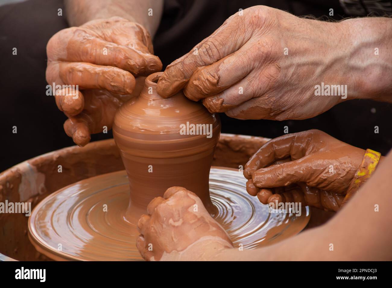 Master class on modeling of clay on a potter's wheel In the pottery ...