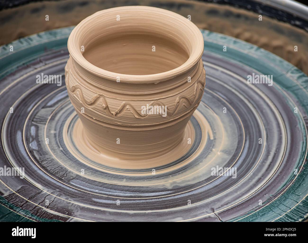 Master class on modeling of clay on a potter's wheel In the pottery ...