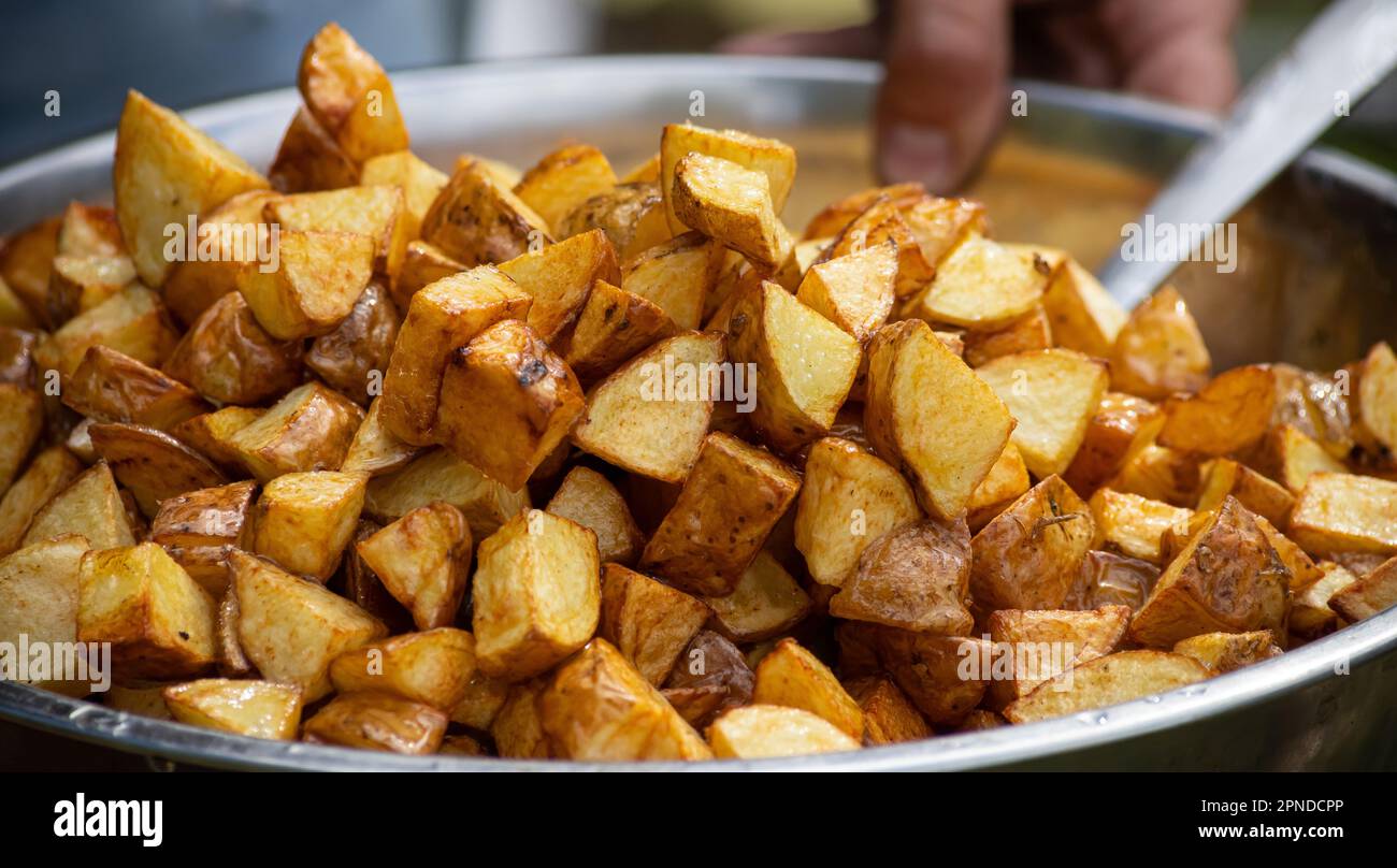 delicious grilled fried potatoes. street food. potat Stock Photo - Alamy