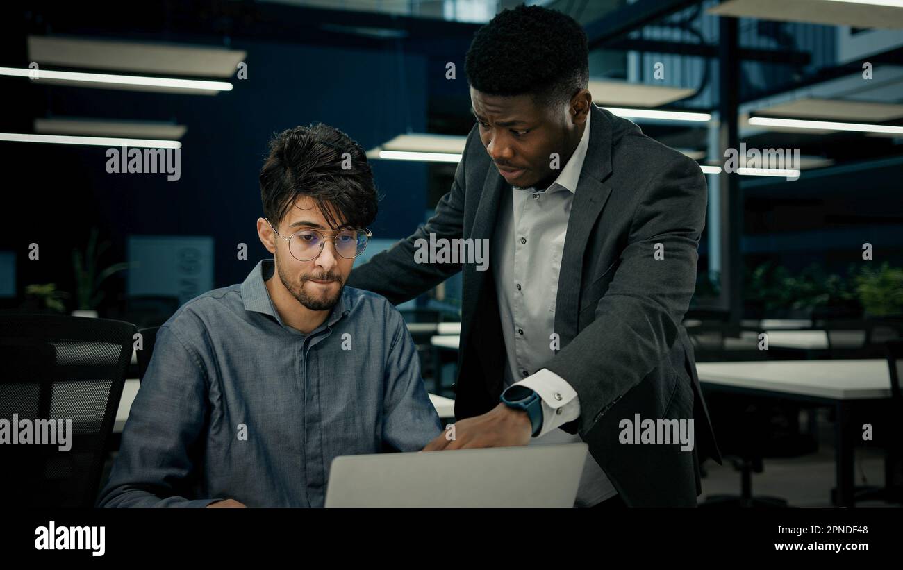 Annoyed furious african businessman shout on arabian worker angry man ...