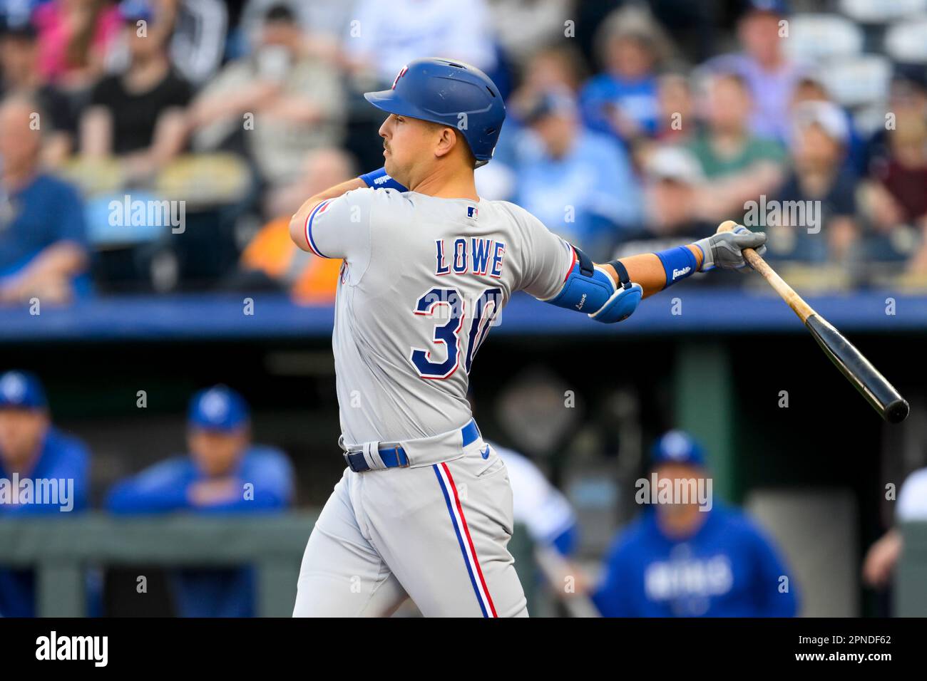 Texas Rangers' Nathaniel Lowe follows through on a swing during the ...