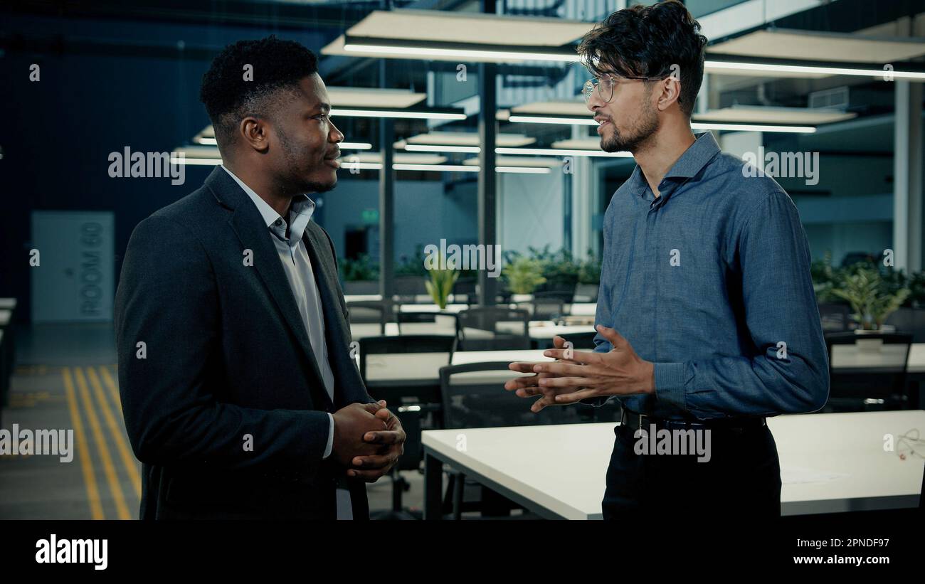 Motivated active african indian men colleagues team office workers ...