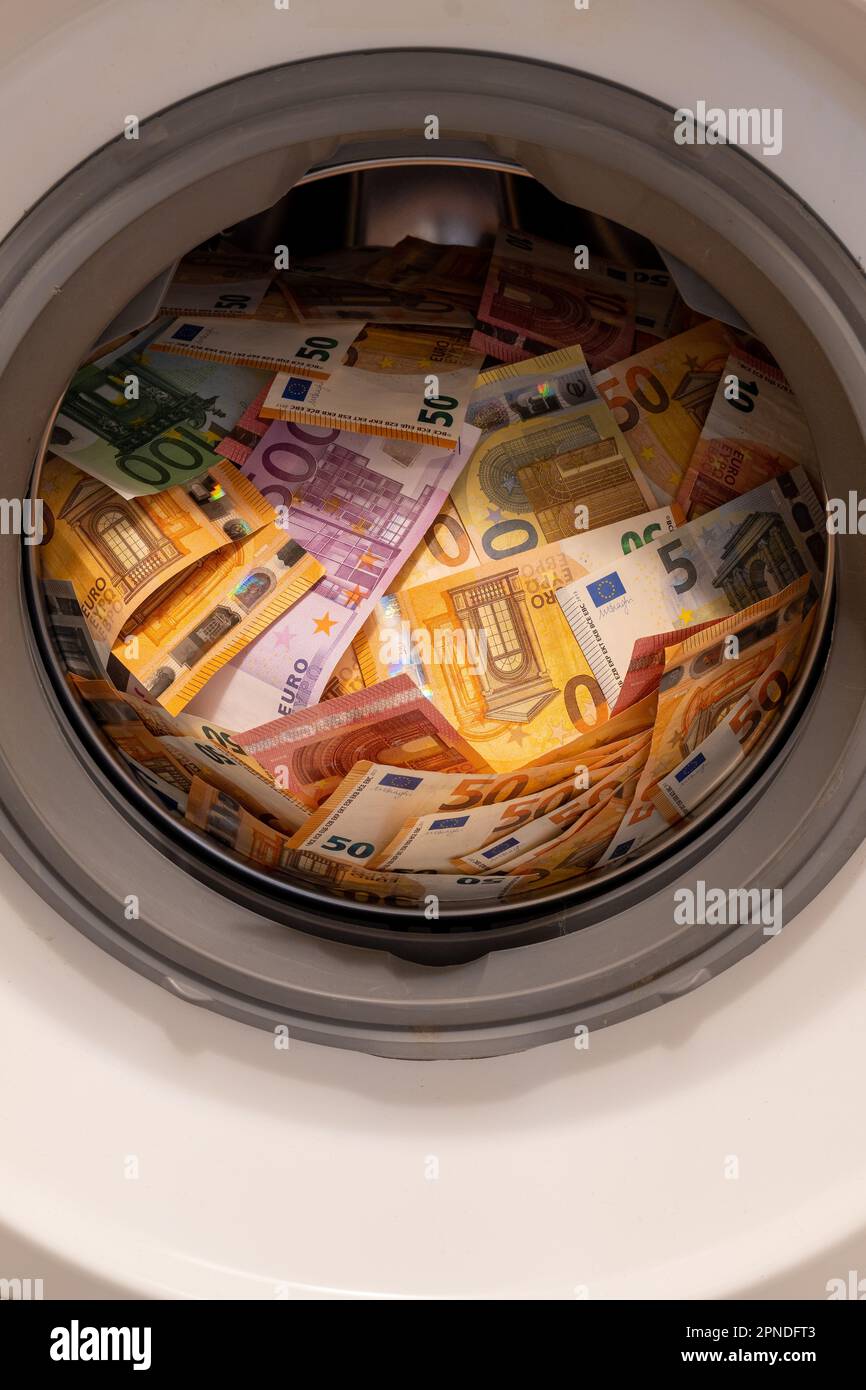 Closeup of a big pile of money in an open washing machine. Money ...