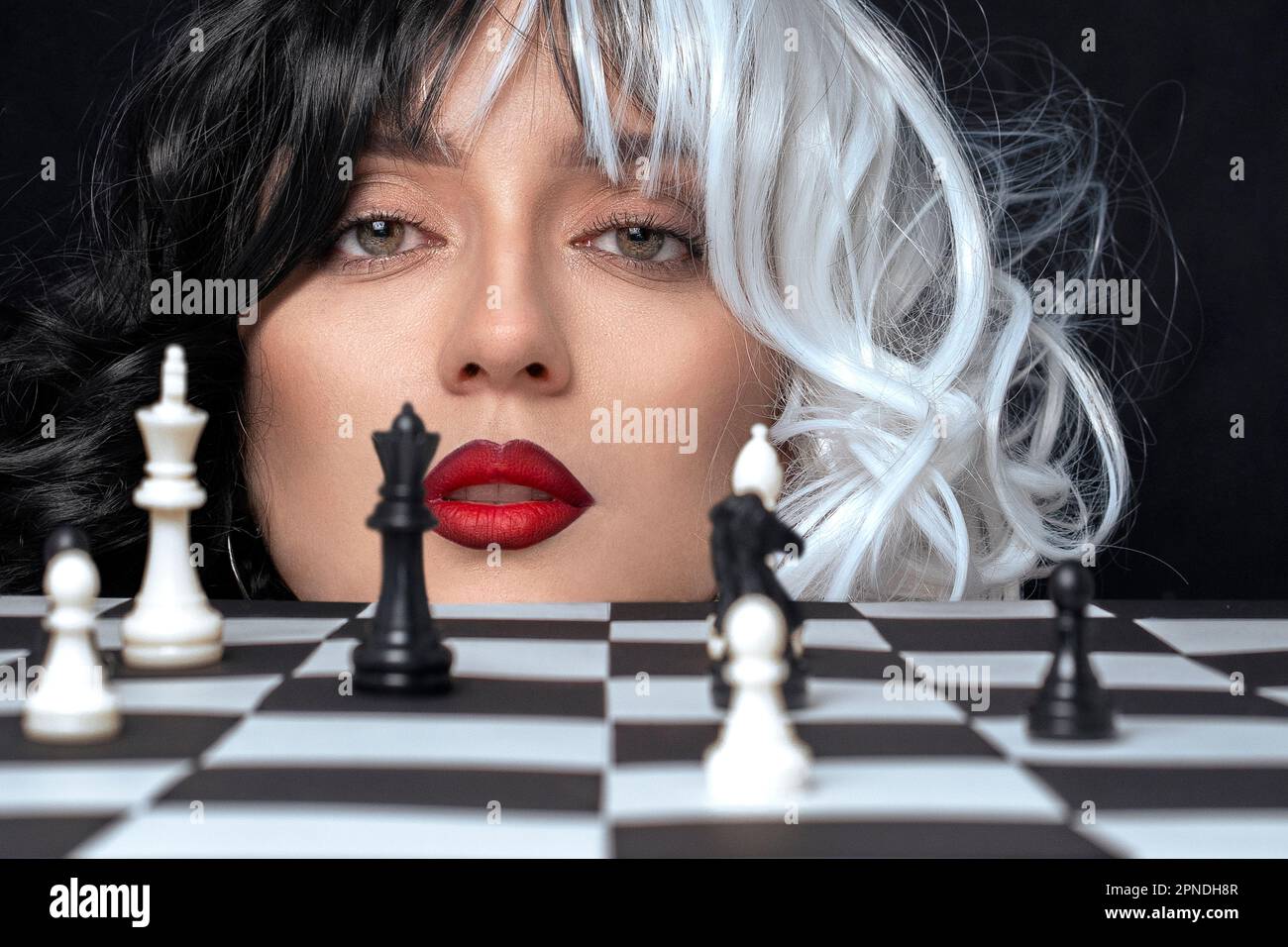 Beautiful woman with chess portrait Stock Photo - Alamy