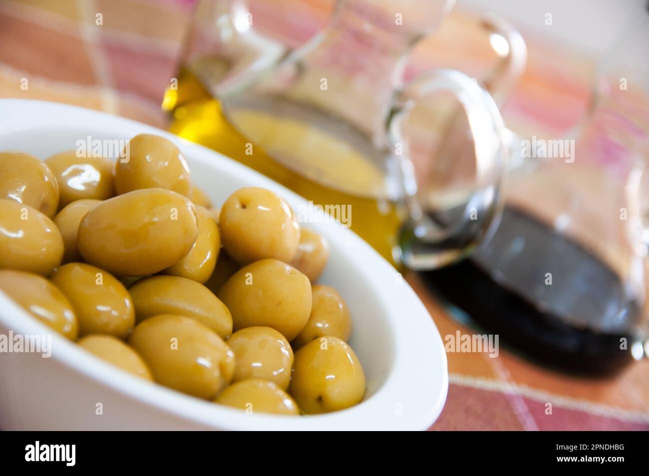 Green olives marinated with olive oil and balsamic vinegar Stock Photo ...