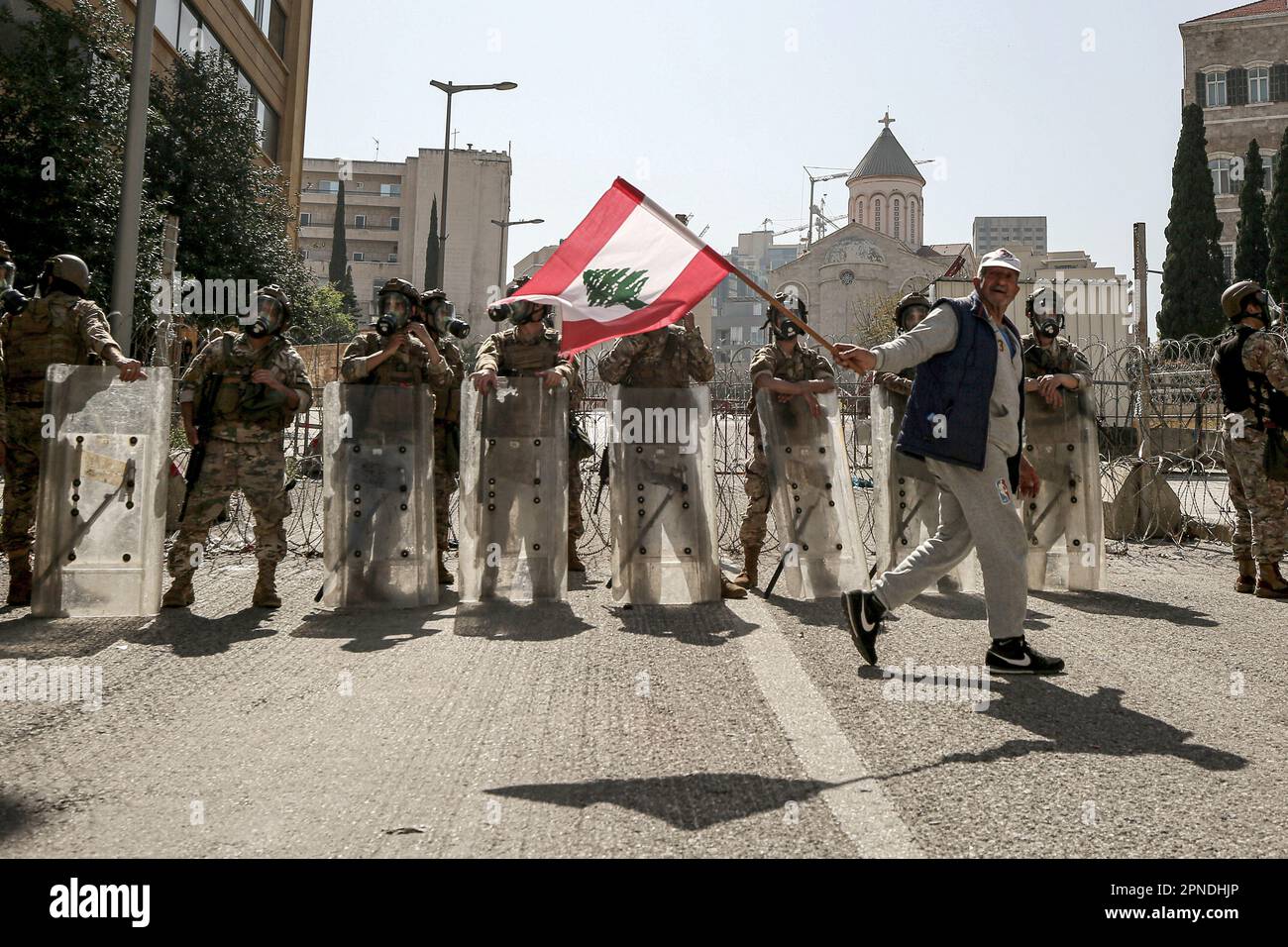 Beirut, Lebanon. 18th Apr, 2023. A retired Lebanese soldier waves the ...