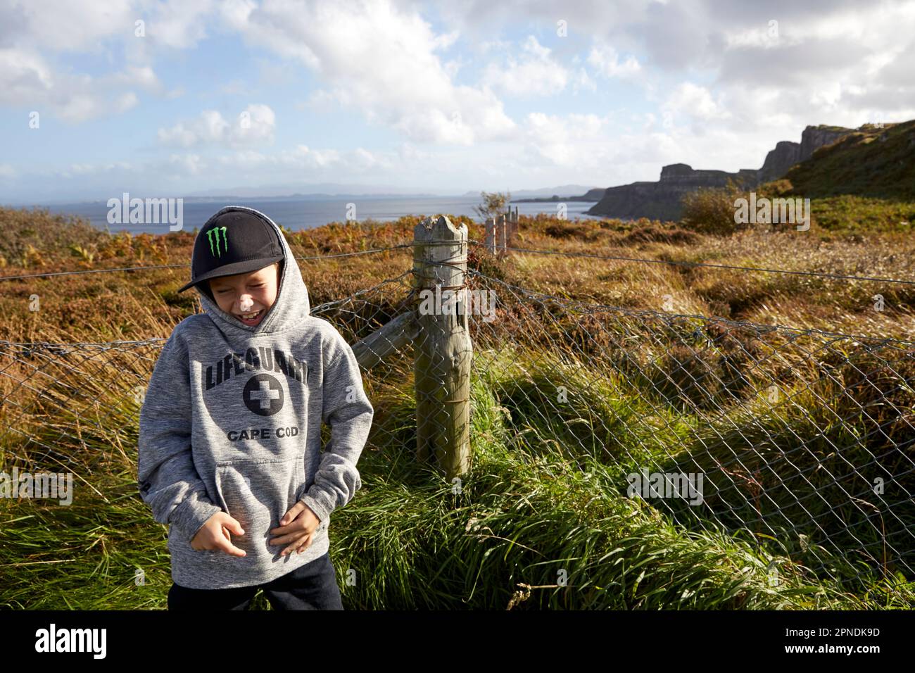 Child laughing on the tour of trotternish peninsula on isle of skye ...