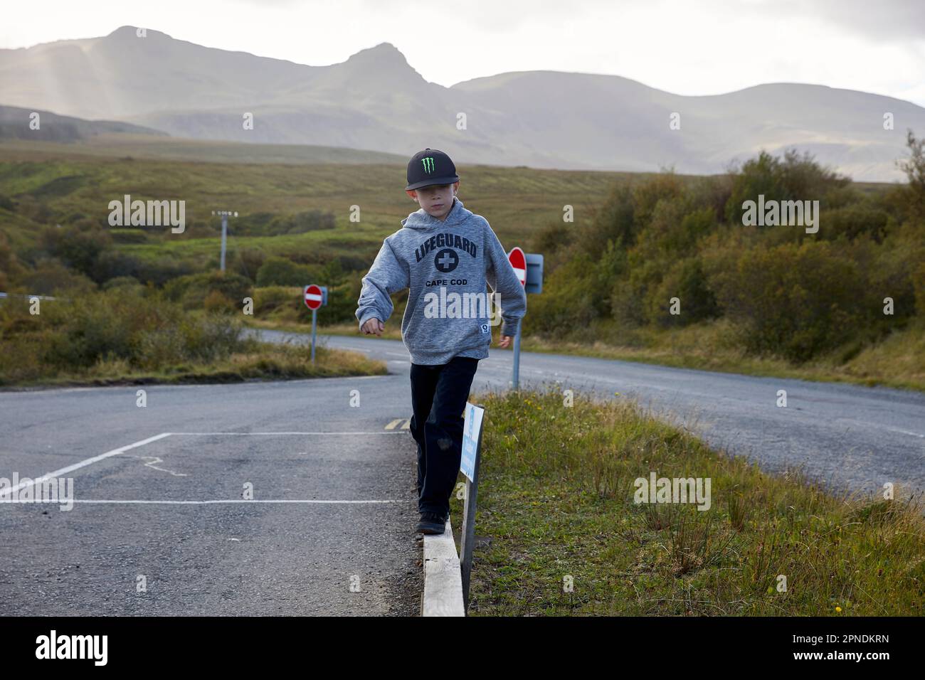 Child exploring trotternish peninsula on isle of skye highlands of ...