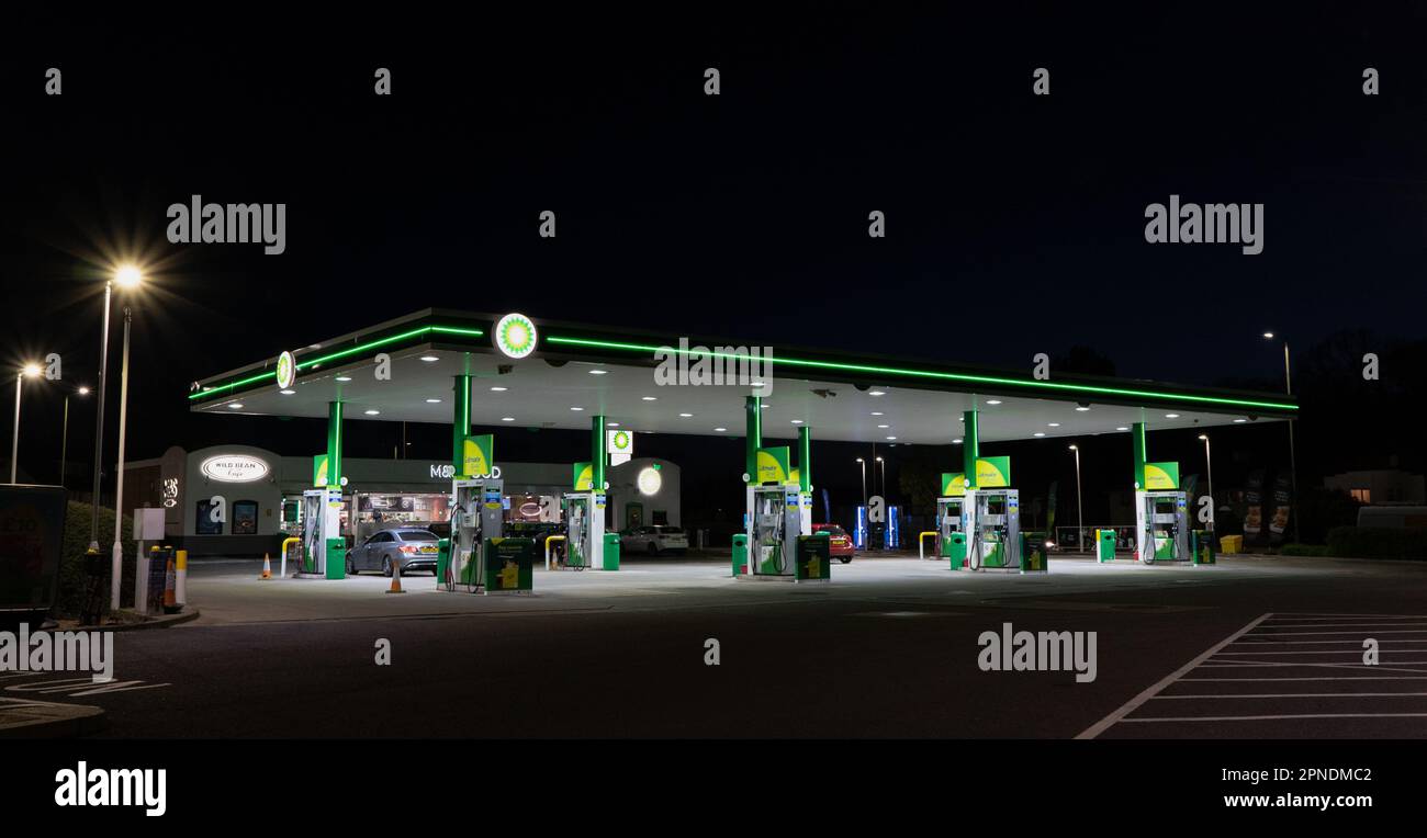 BP petrol station illuminated at night Stock Photo - Alamy