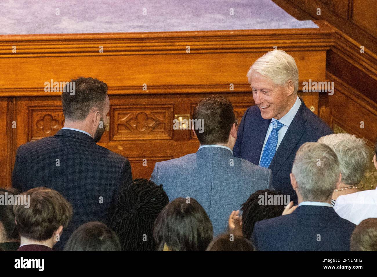 Former US president Bill Clinton speaks to Nicolas Trimble (centre ...