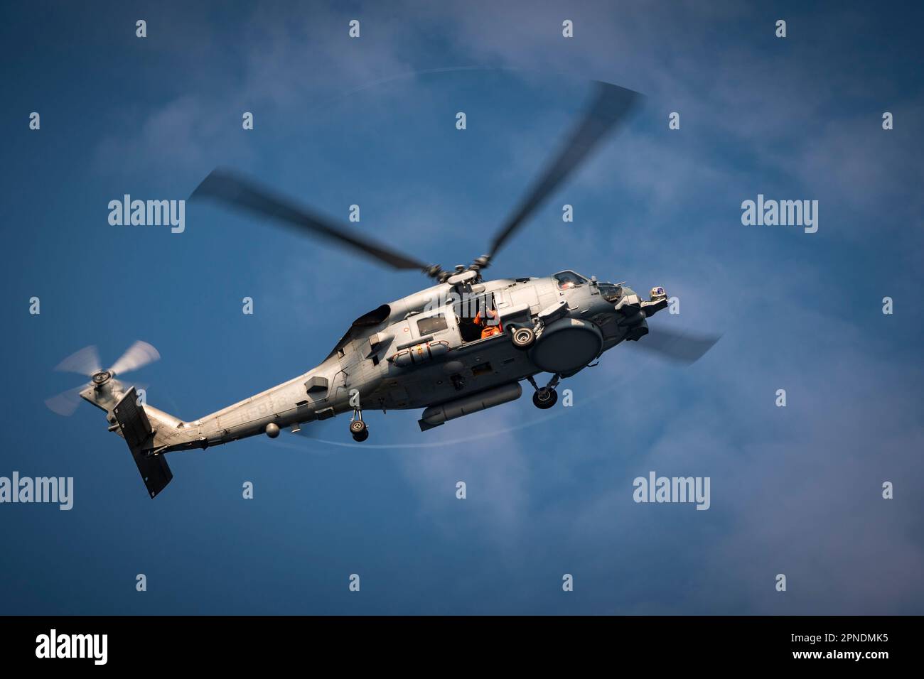 Royal Danish Navy MH-60R Seahawk helicopter flying from patrol ship ...