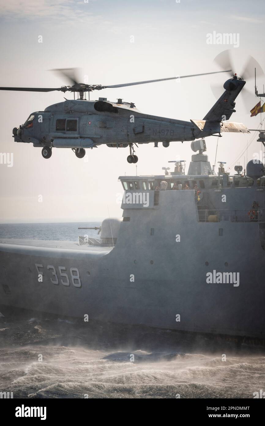 Royal Danish Navy MH-60R Seahawk helicopter flying from patrol ship ...