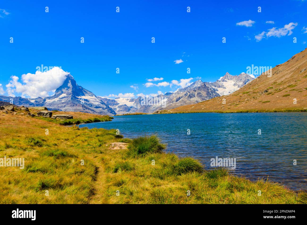 View of Stelli Lake (Stellisee) and Matterhorn mountain at summer in ...