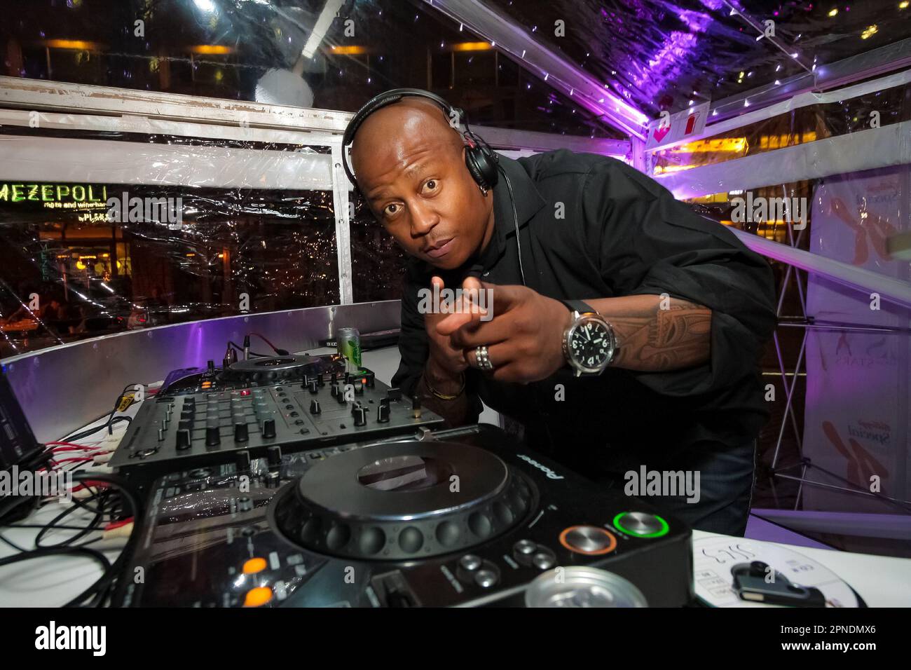 A professional African American male DJ posing pointing at the camera ...