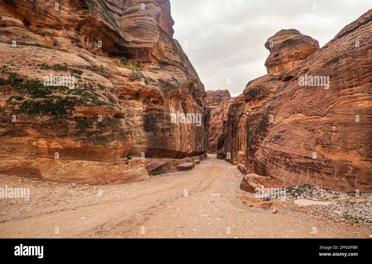 Al Siq Canyon in Petra, Jordan, orange red sandstone walls on both ...