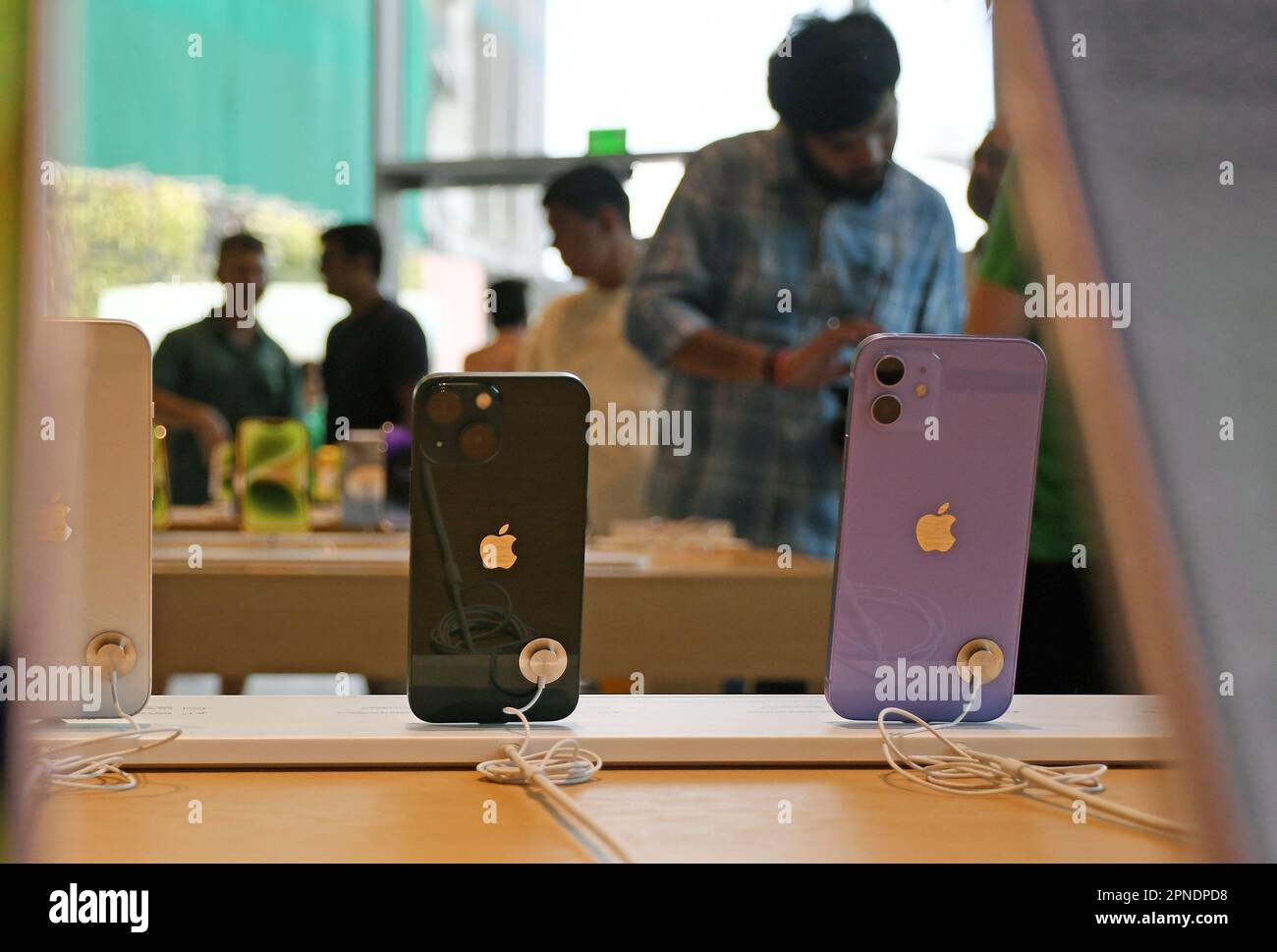 Mumbai, India. 18th Apr, 2023. People are seen checking Apple products ...