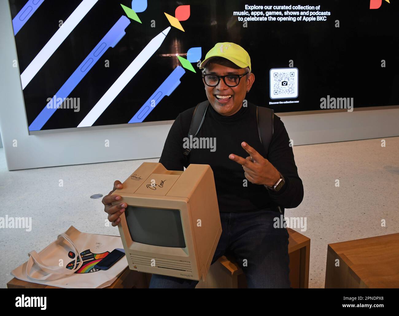 Mumbai, India. 18th Apr, 2023. A man poses for a photo holding a Apple ...