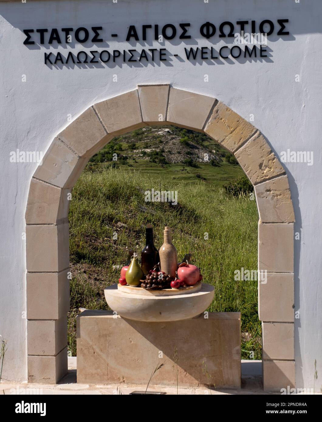 Welcome sign and still life showing village produce located on the ...
