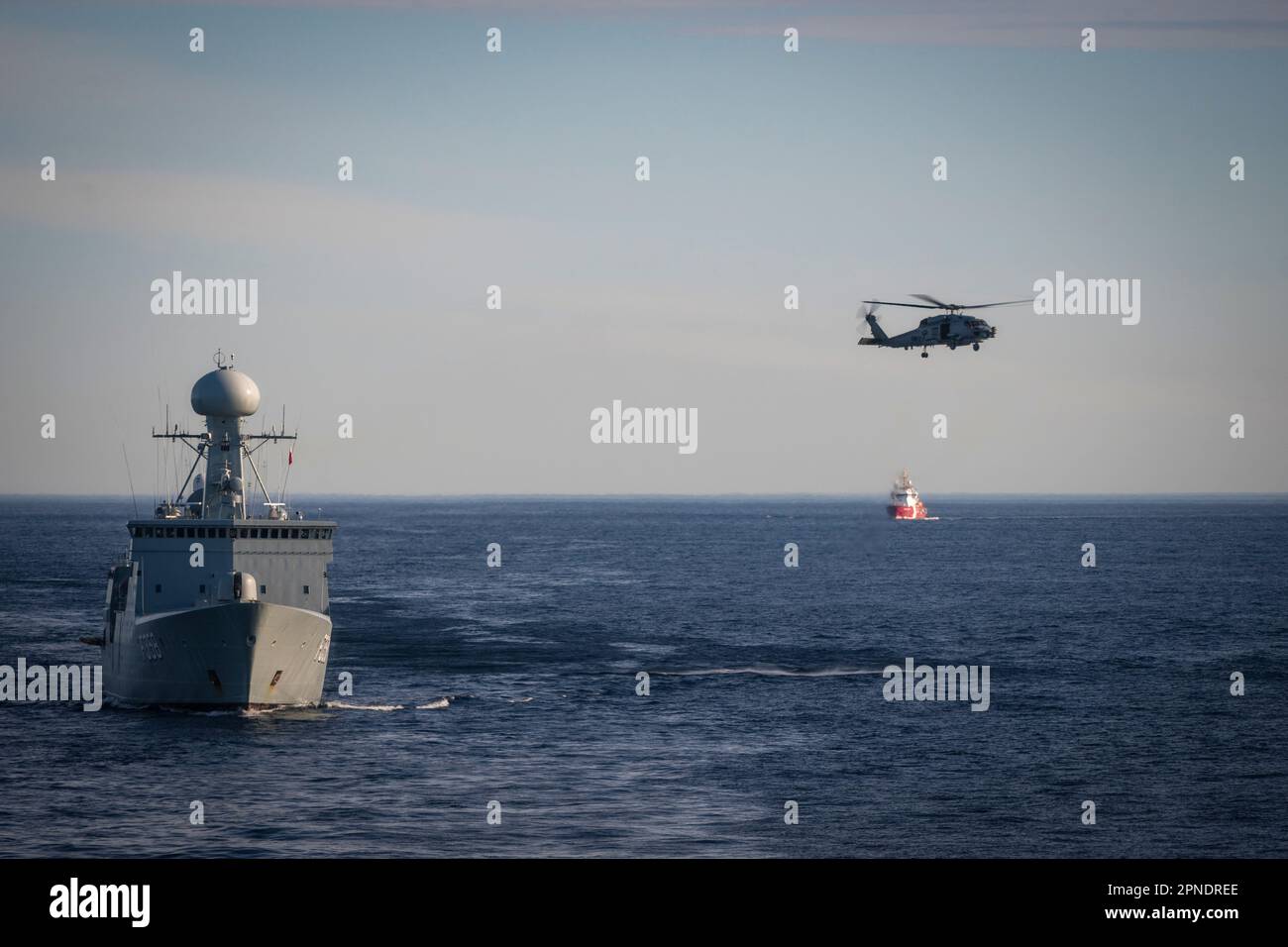 Royal Danish Navy MH-60R Seahawk helicopter flying from patrol ship ...