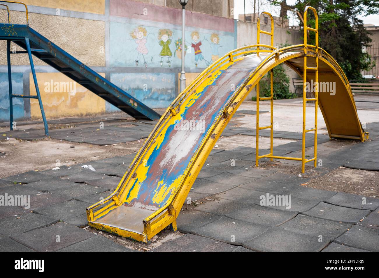 run down slide on old playground, Damascus, Syria Stock Photo - Alamy