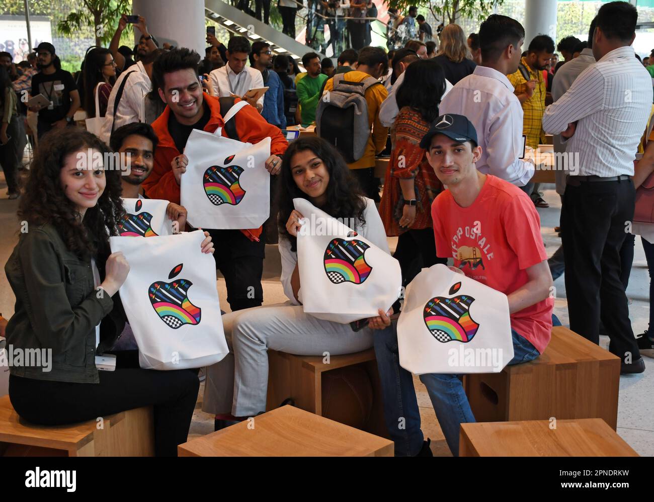 Mumbai, India. 18th Apr, 2023. People with Apple bags pose for photos ...
