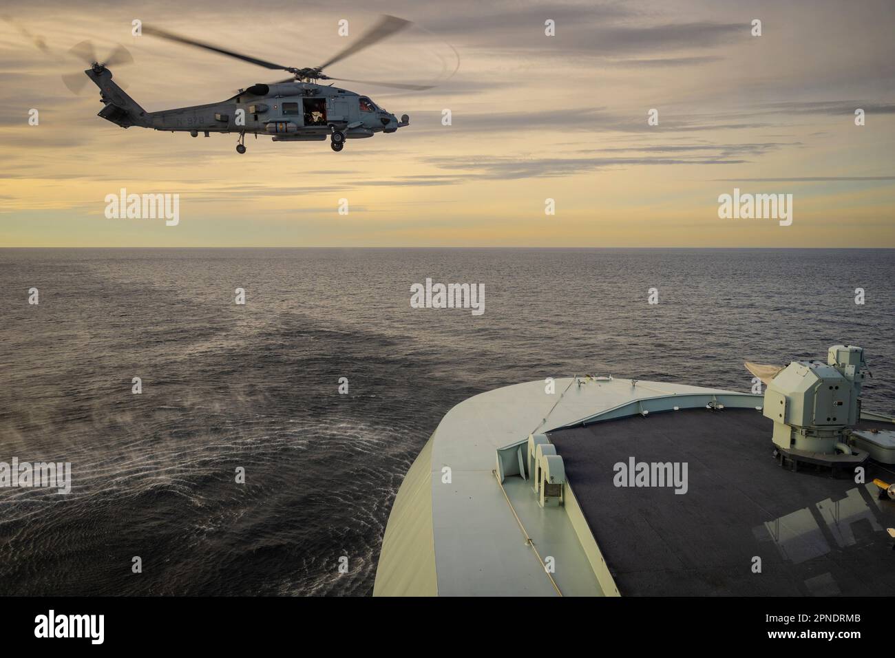 Royal Danish Navy MH-60R Seahawk helicopter flying from patrol ship ...