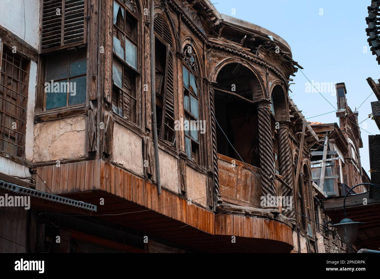 Historic wooden facade of a building ruin in old town of Damascus ...