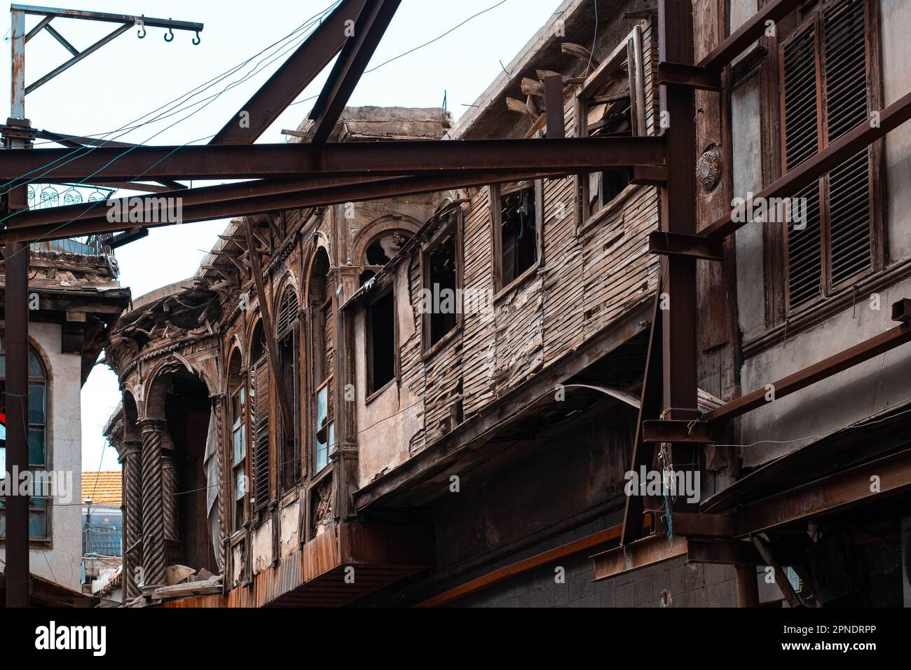 Historic wooden facade of a building ruin in old town of Damascus ...