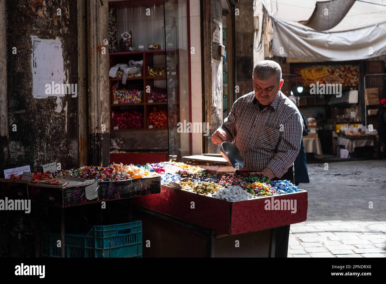 Damascus, Syria - april, 2023: Vendor selling sweets and candy on Souk ...