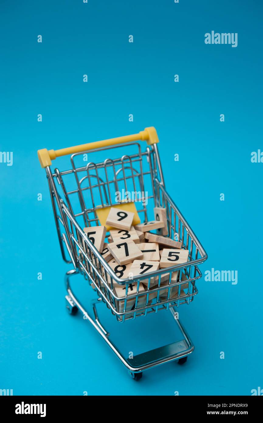 shopping cart and tiles with numbers inside it Stock Photo - Alamy