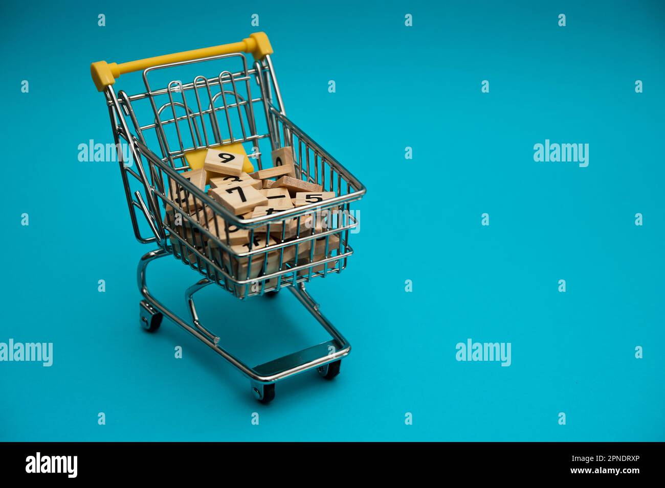 shopping cart and tiles with numbers inside it Stock Photo - Alamy